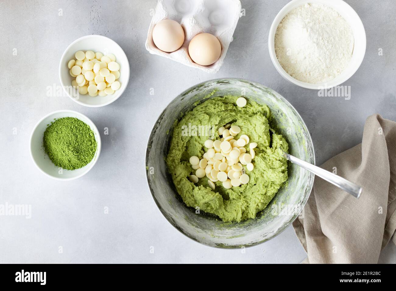 Flat lay composition with green tea matcha dough, white chocolate chips ...