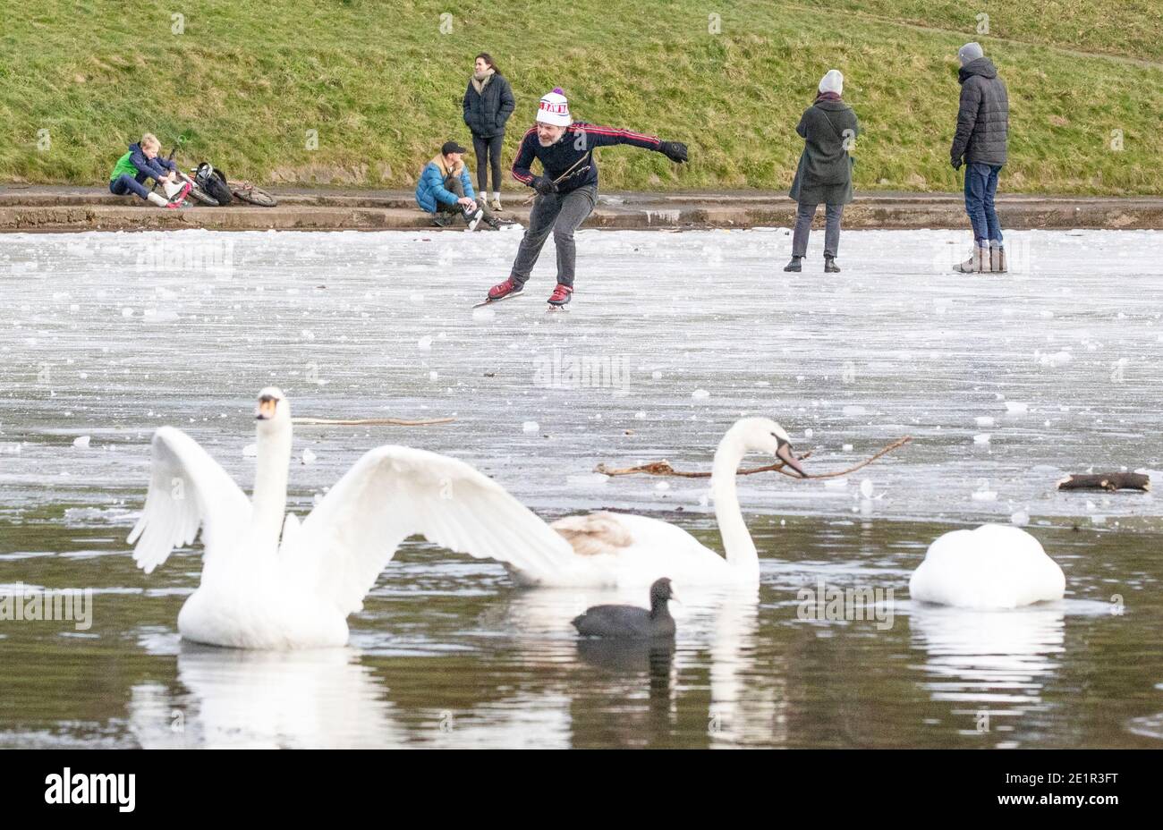 A man ice-skates on the frozen pond in Inverleith Park, Edinburgh Stock ...