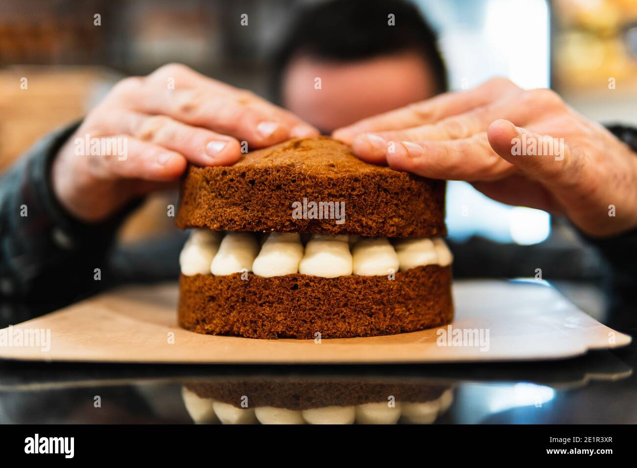 Hand placing carrot hi-res stock photography and images - Alamy