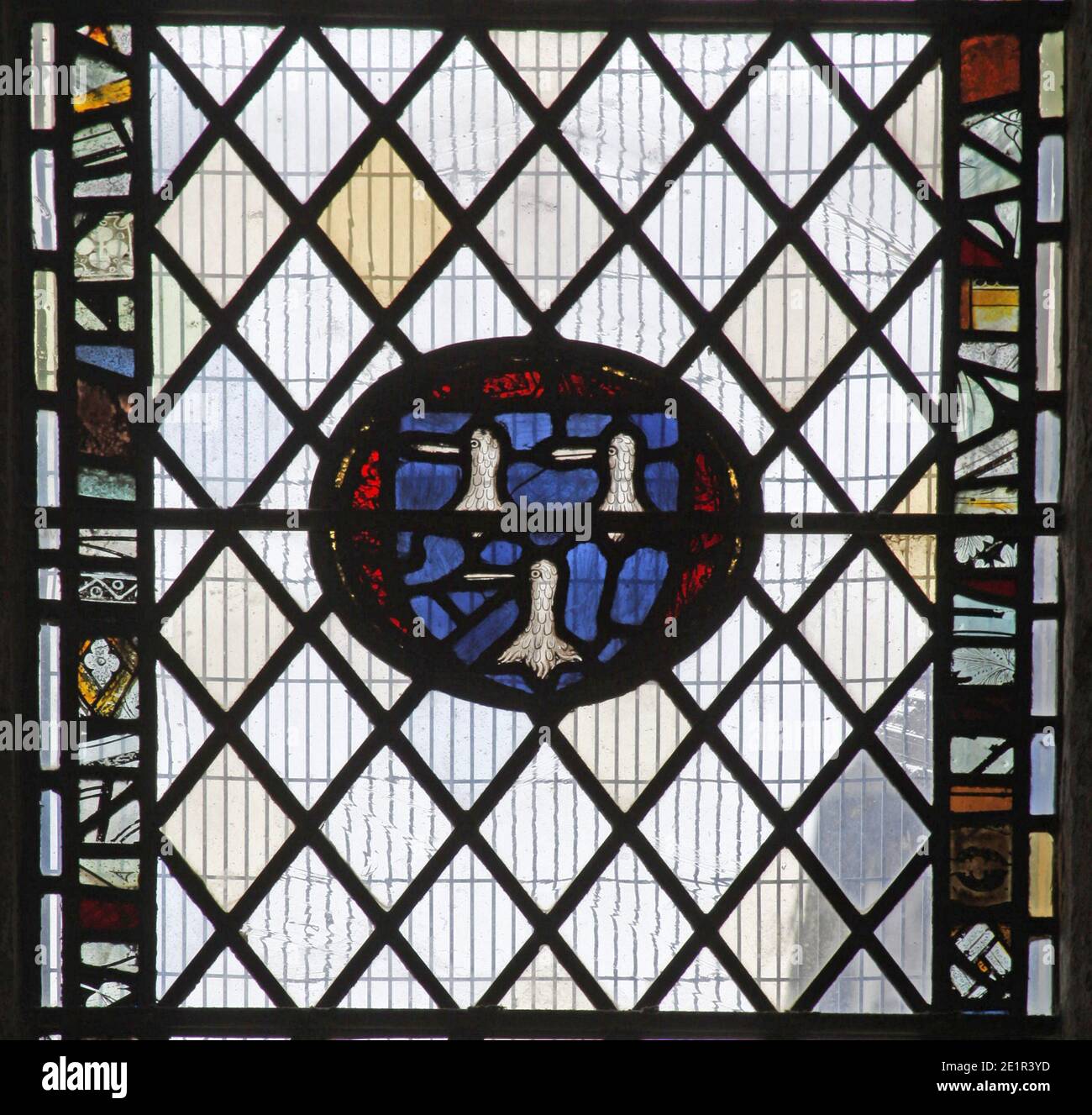 15th century stained glass. Fragments are reinserted into plain glass ...