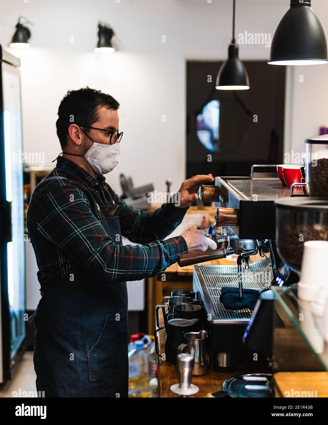 Masked barista hi-res stock photography and images - Alamy