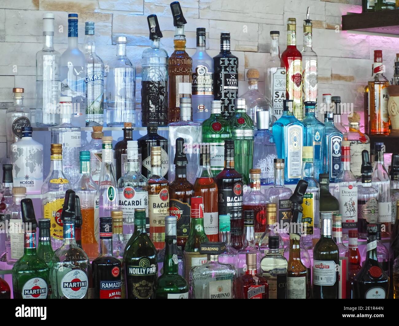 Many bottles of alcohol in a bar to create drinks Stock Photo - Alamy