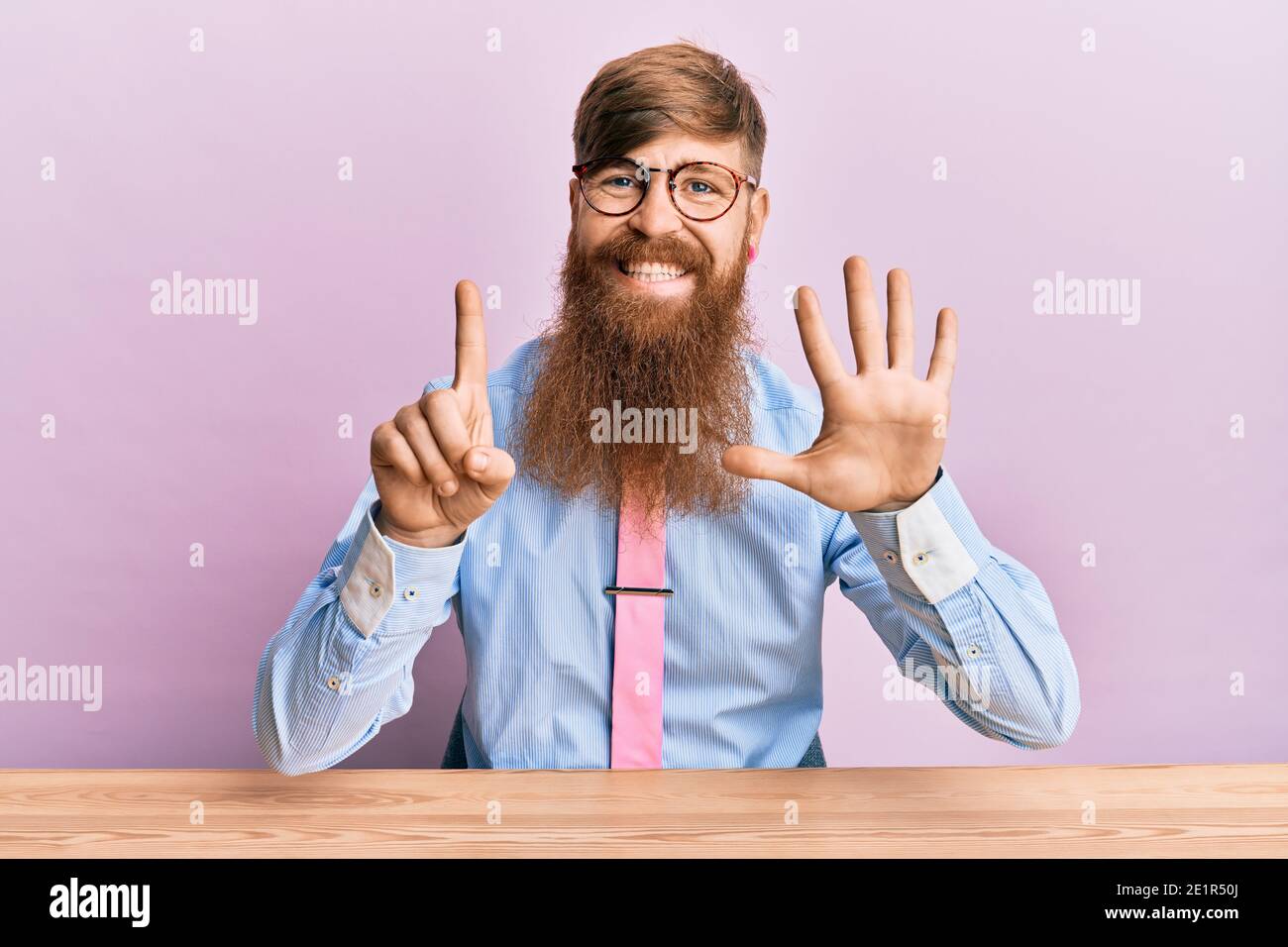 Young irish redhead man wearing business shirt and tie sitting on the ...