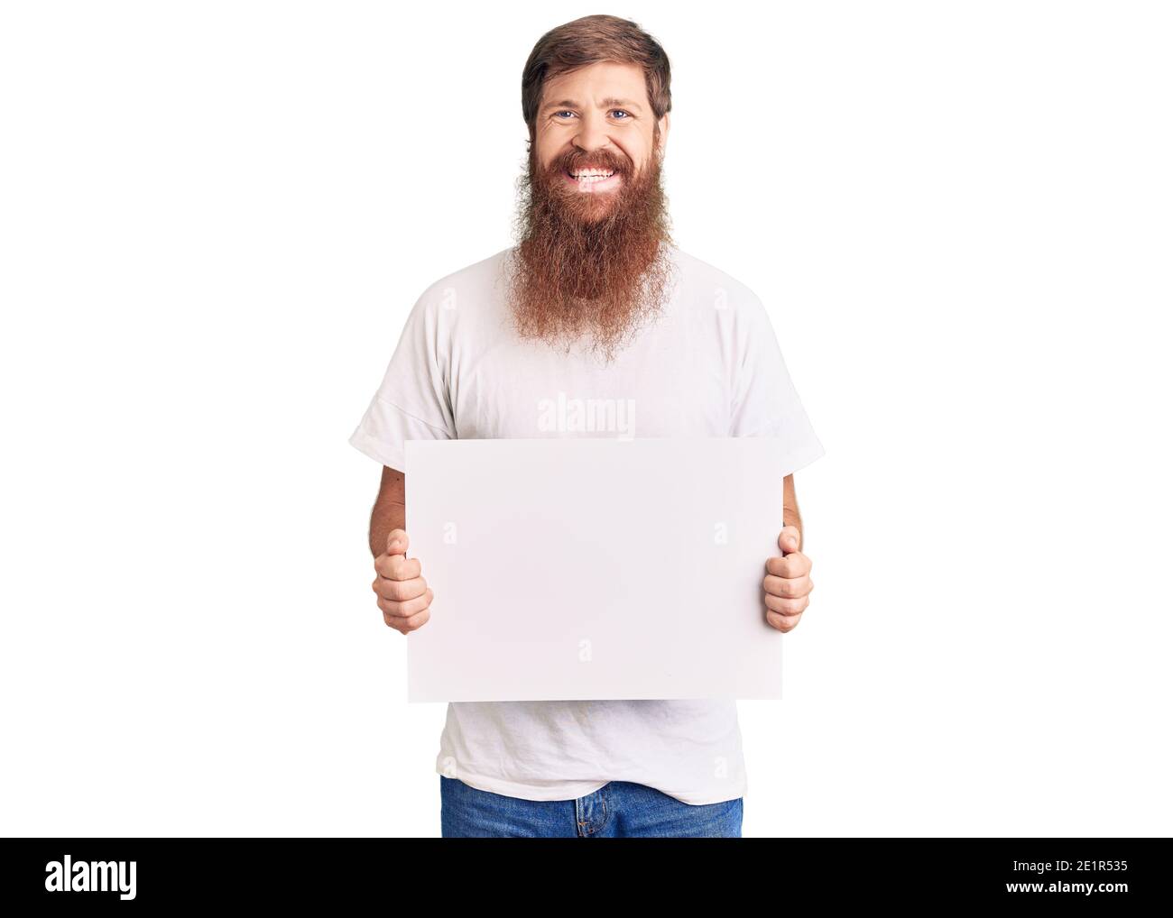 Handsome Young Red Head Man With Long Beard Holding Blank Empty Banner