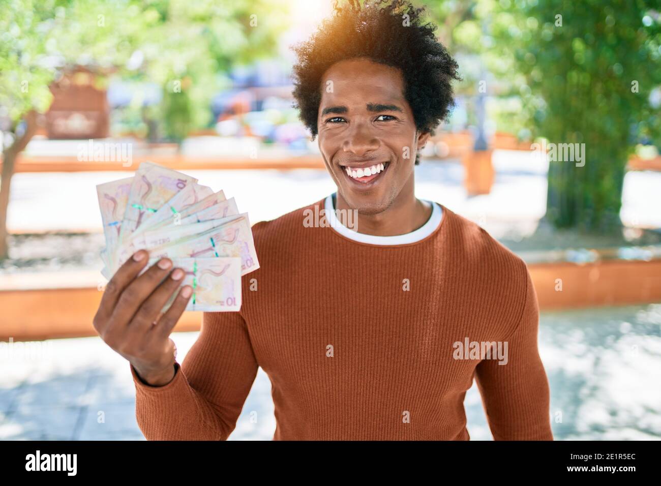 Young african american man smiling happy. Standing with smile on face ...