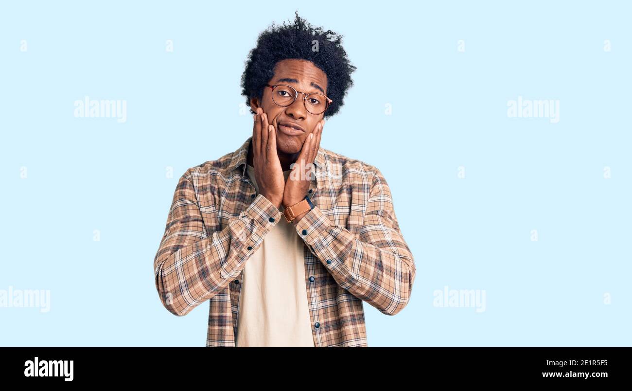 Handsome african american man with afro hair wearing casual clothes and ...