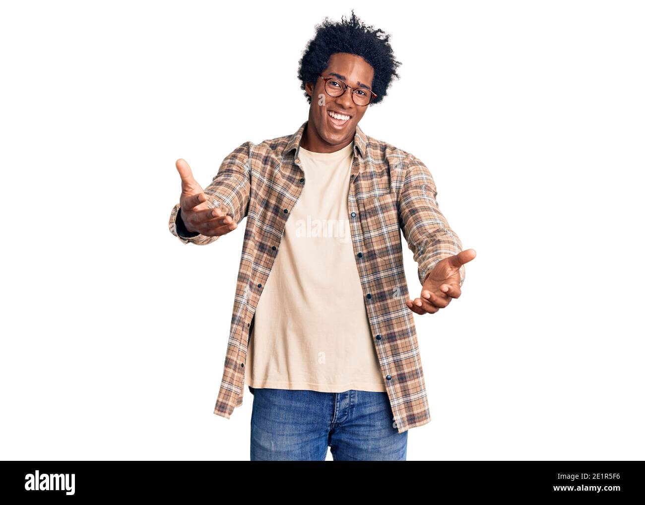 Handsome african american man with afro hair wearing casual clothes and ...