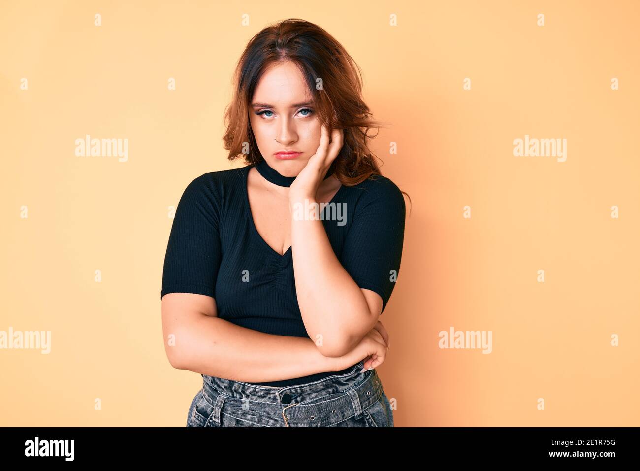 Young beautiful caucasian woman wearing casual clothes thinking looking ...