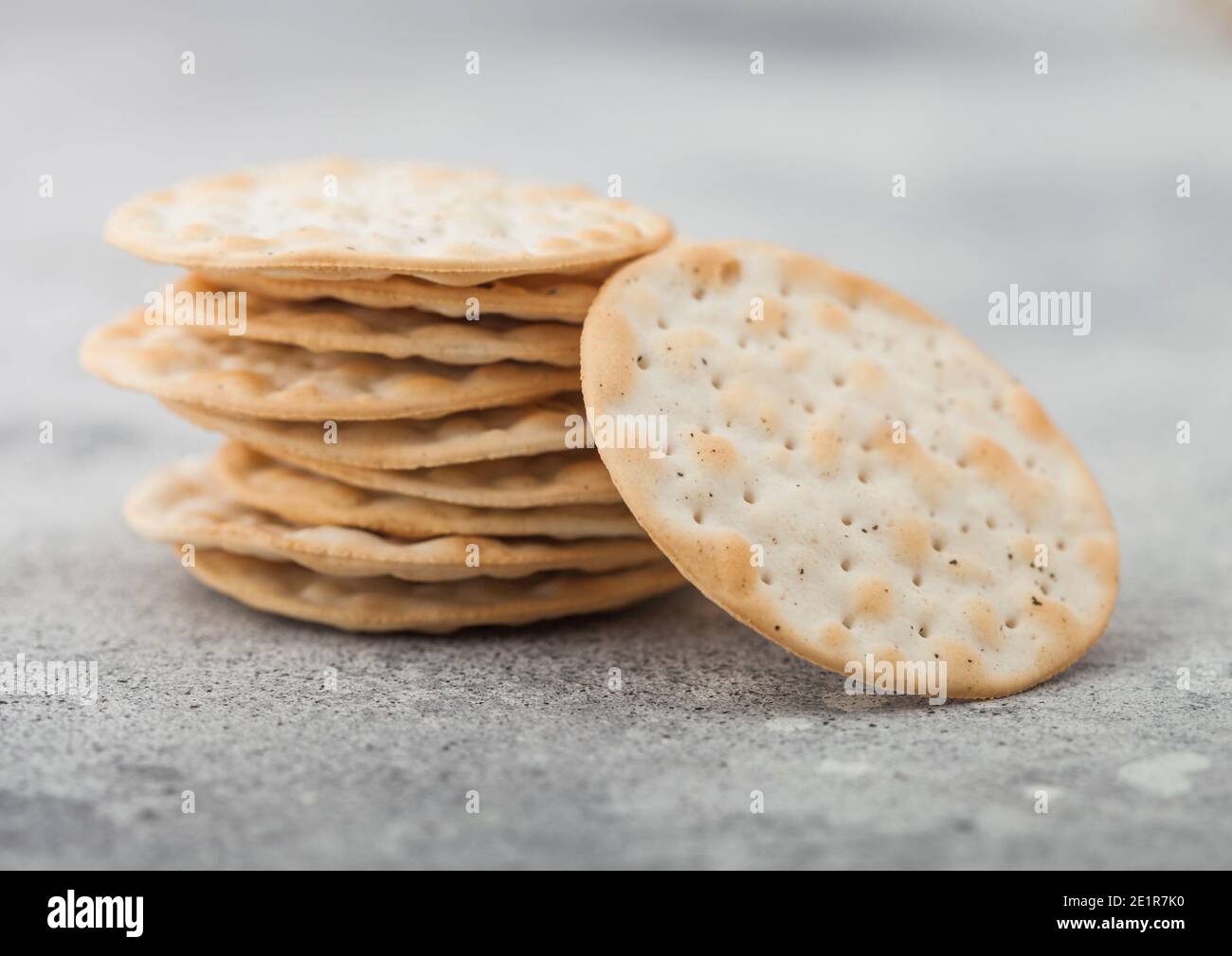 Stack of various organic crispy corn crackers with sesame and salt on ...
