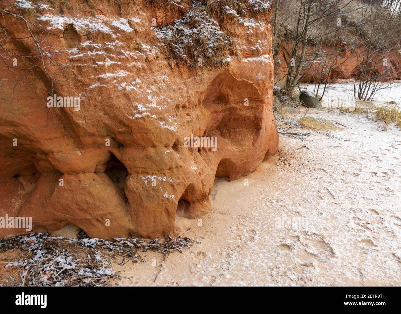 Sea cliff with Devonian sandstone outcrops. During the storm, niches ...