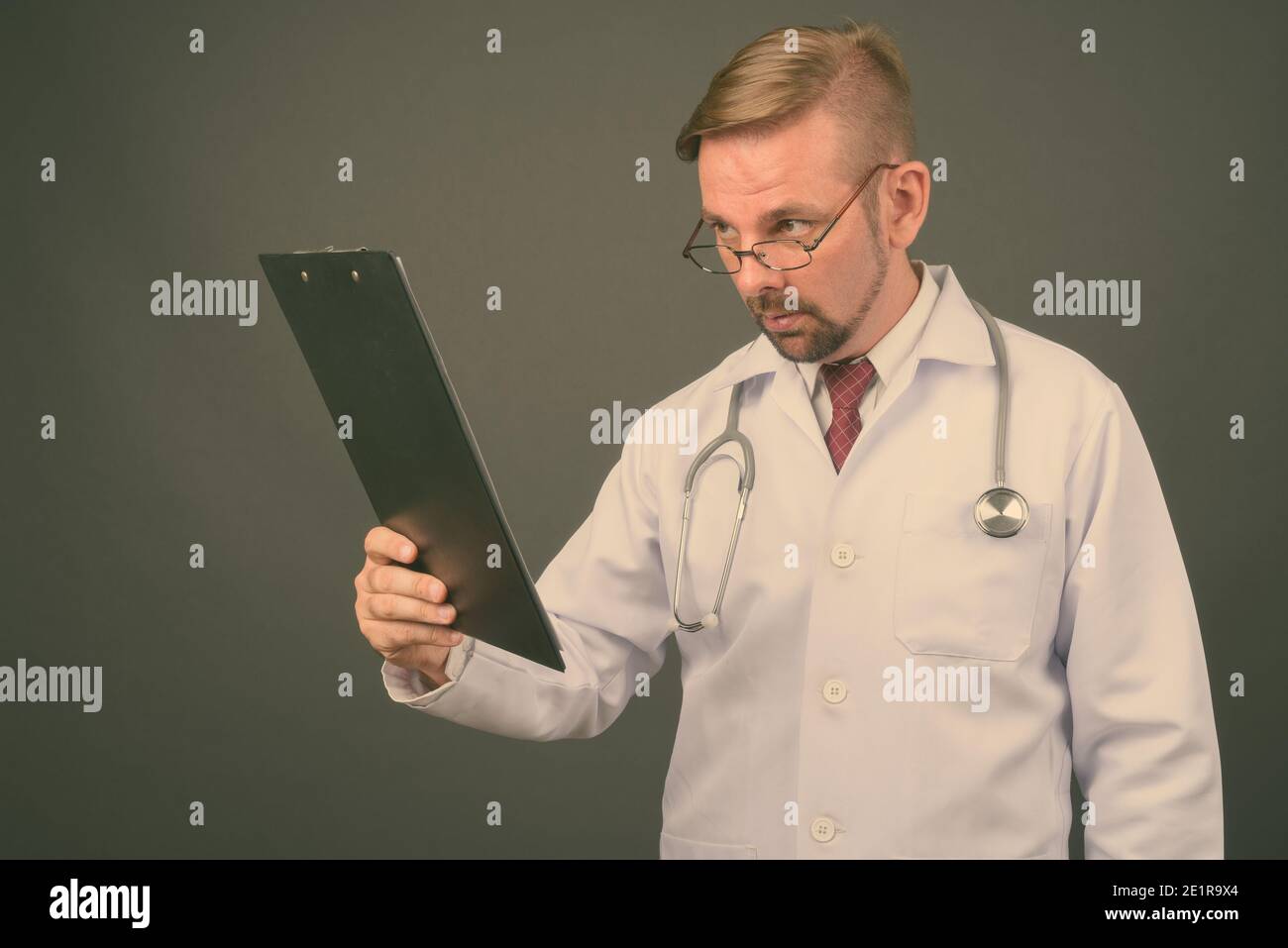 Blond bearded man doctor with goatee against gray background Stock ...