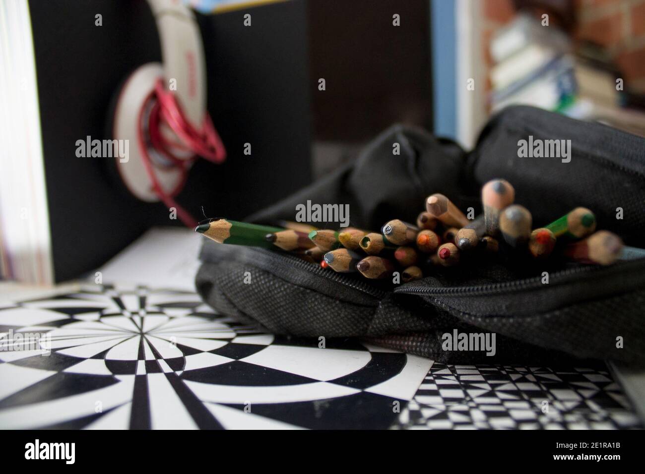 Pencil case of colored pencils, on an abstract background of geometric ...