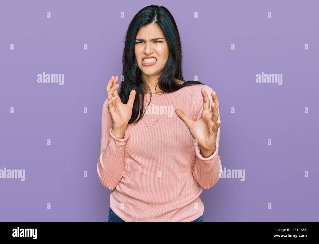 Young hispanic woman wearing casual clothes disgusted expression ...