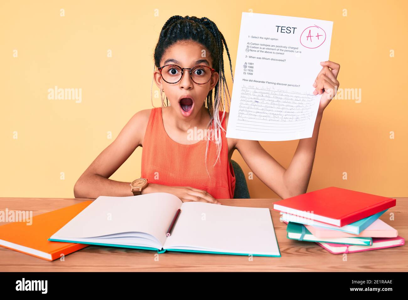 Young african american girl child with braids showing a passed exam ...