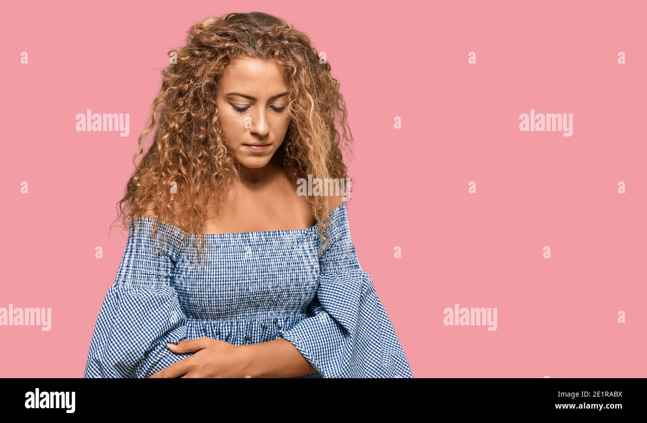 Beautiful caucasian teenager girl wearing summer dress with hand on ...