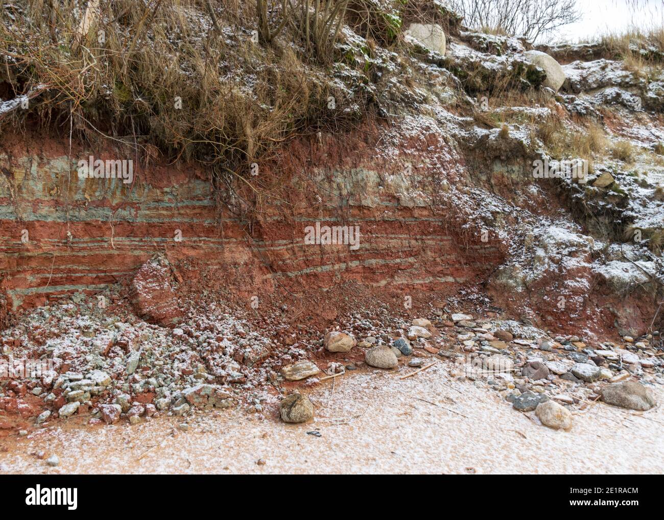 Textured red and white clay outcrop in the sea cliffs. Sandstones and ...