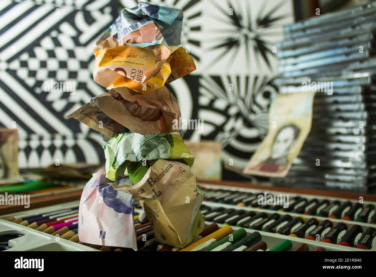 Banknotes of the Venezuelan monetary cone on drawing tools, in an ...