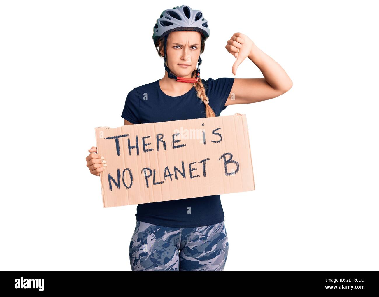 Beautiful caucasian woman holding there is no planet b banner with ...