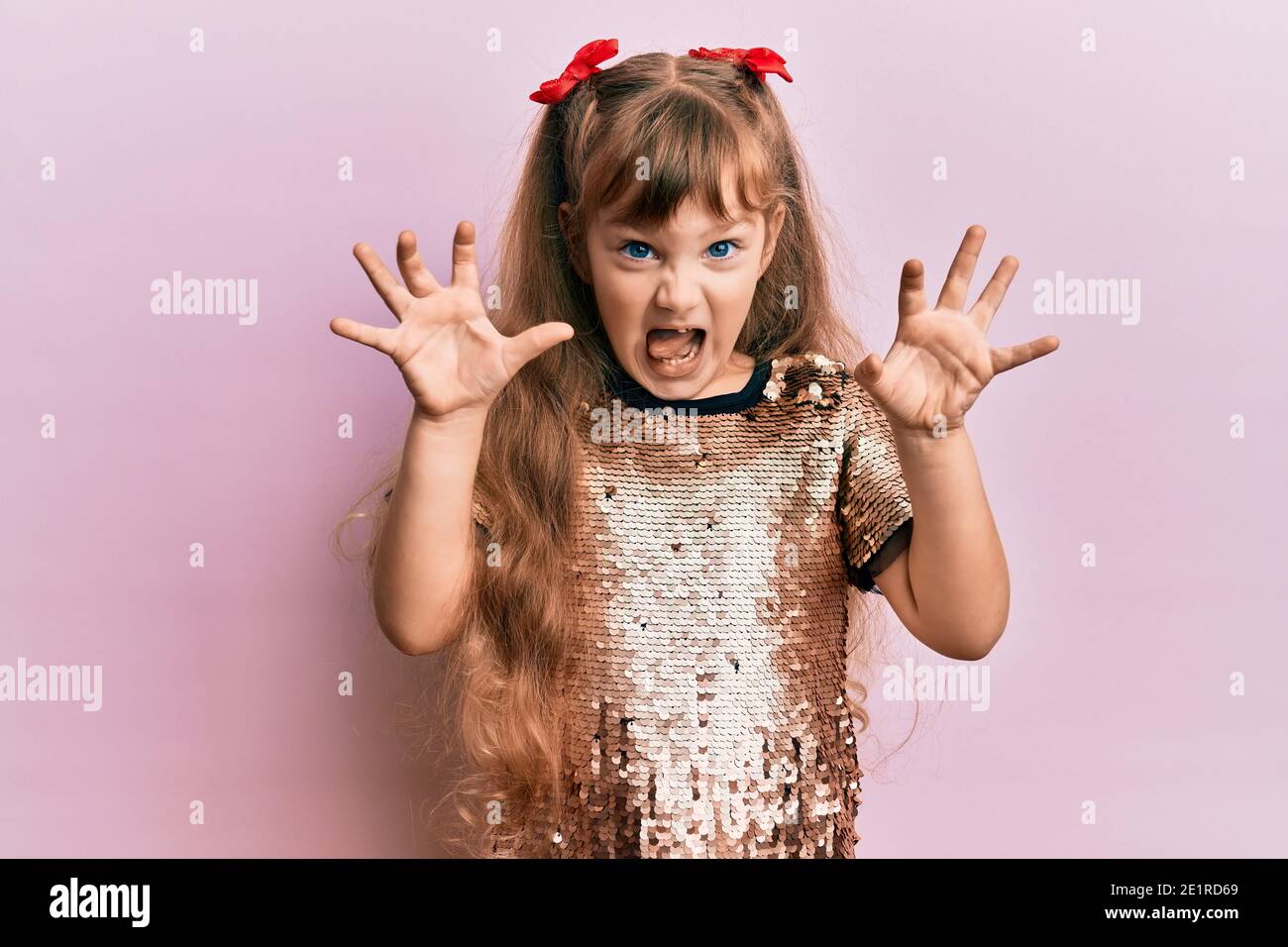 Little caucasian girl kid wearing festive sequins dress afraid and ...