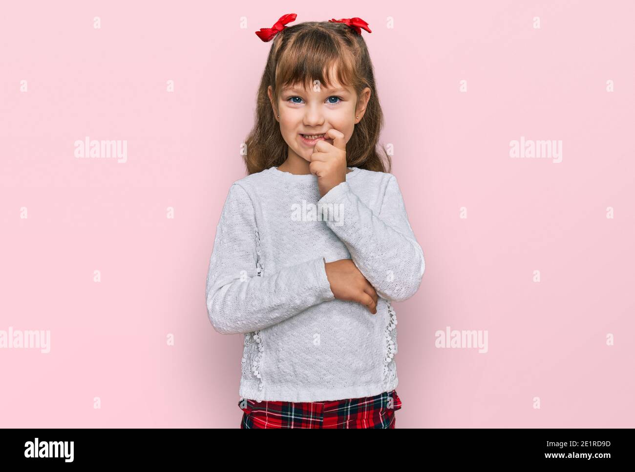Little caucasian girl kid wearing casual clothes looking confident at ...