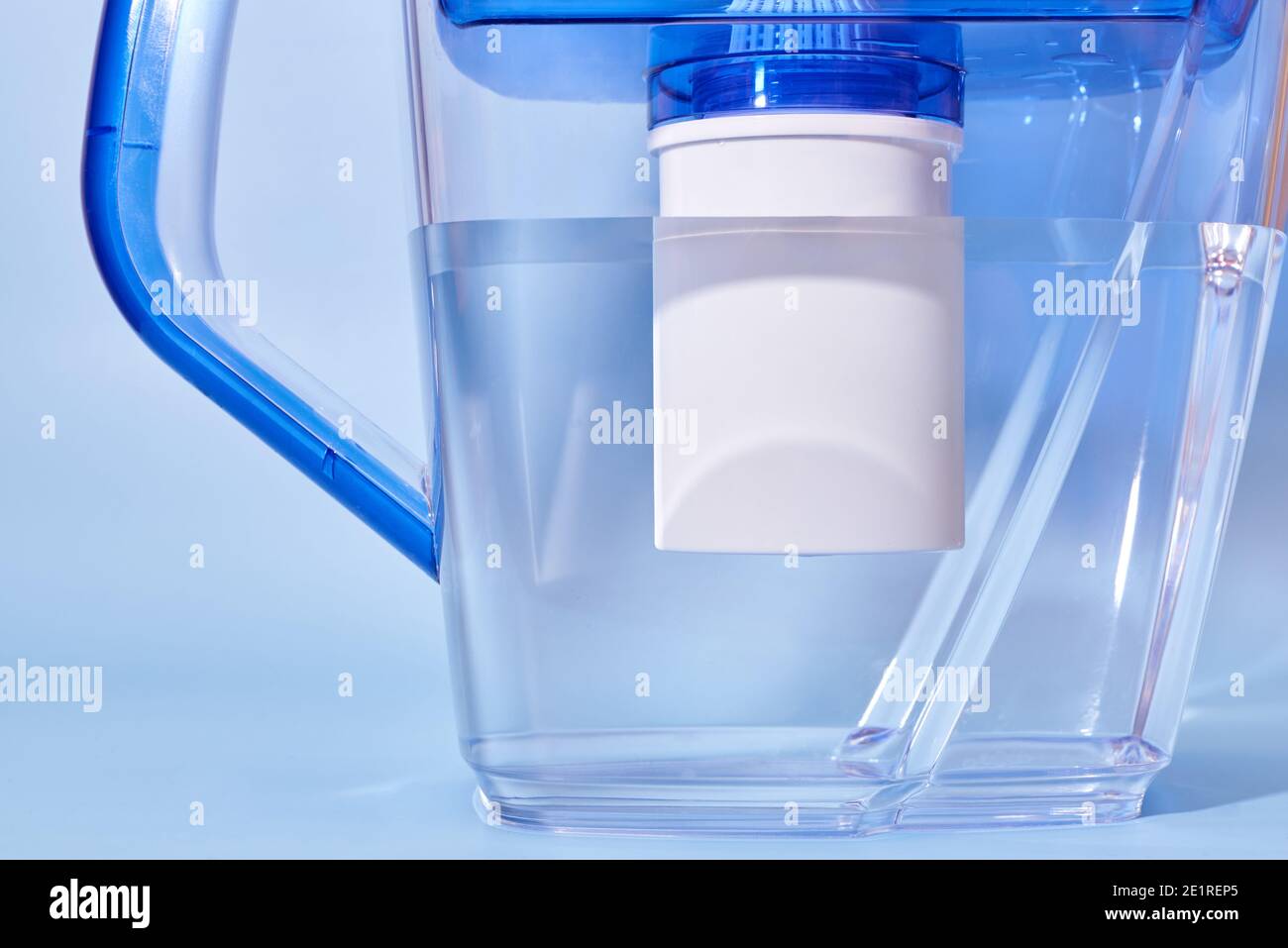 Water filter for home use on a blue background, the theme of a healthy ...