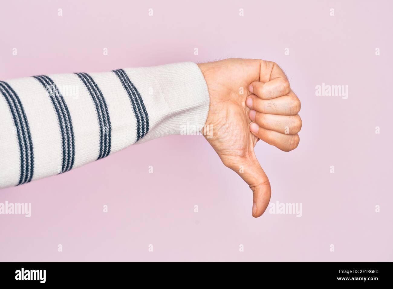 Hand of caucasian young man showing fingers over isolated pink ...