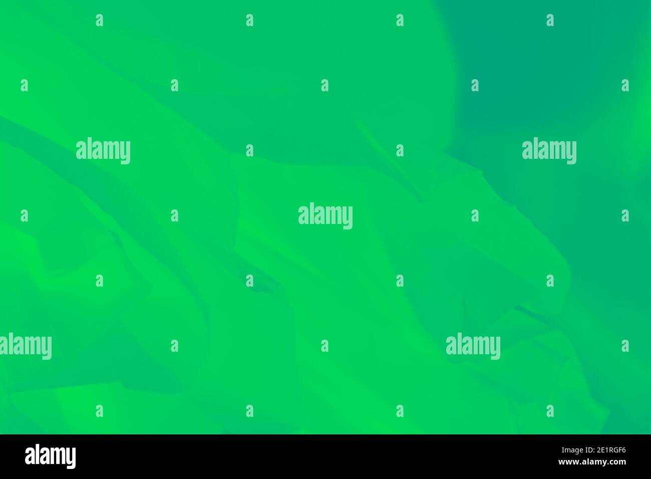 Elegant green shine flying fabric abstract background Stock Photo - Alamy