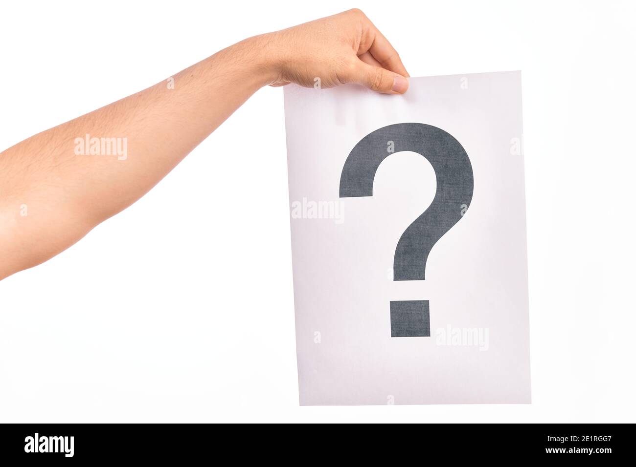 Hand of caucasian young man holding paper showing question mark over ...