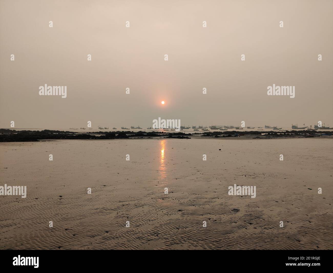 Beautiful sunset view from on a beach in Mumbai city with reflection of ...