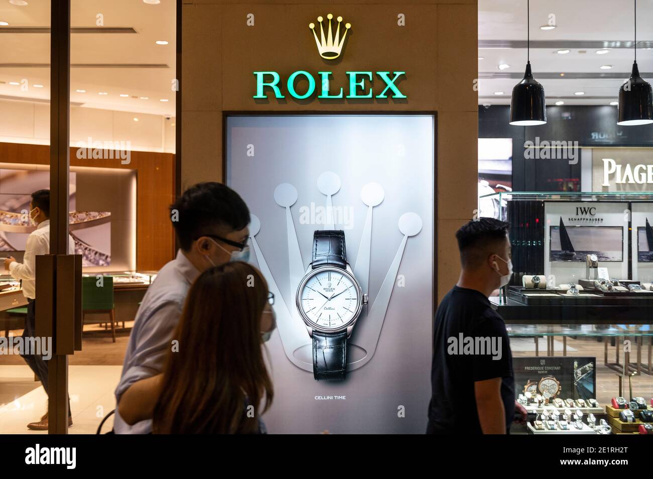 Pedestrians wearing masks seen in front of the Swiss luxury watchmaker ...