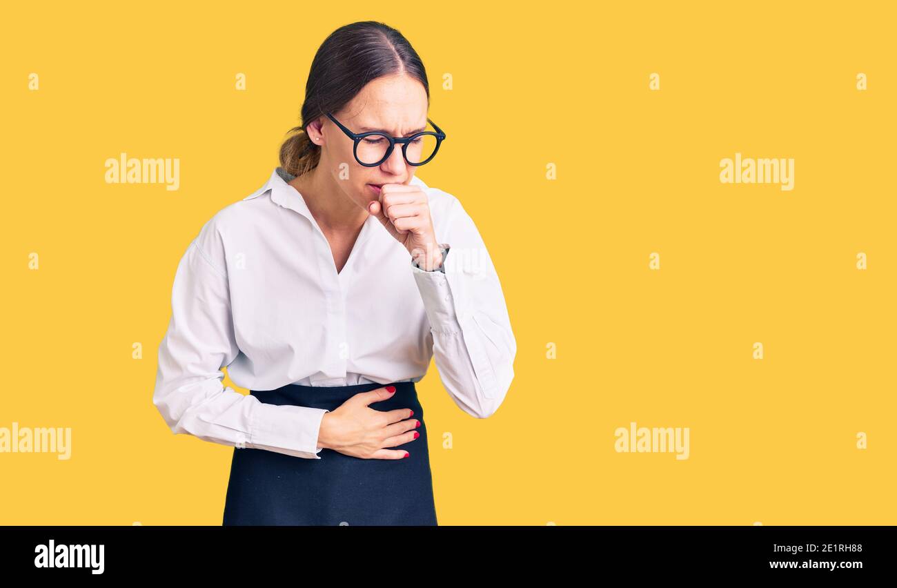 Beautiful brunette young woman wearing professional waitress apron ...