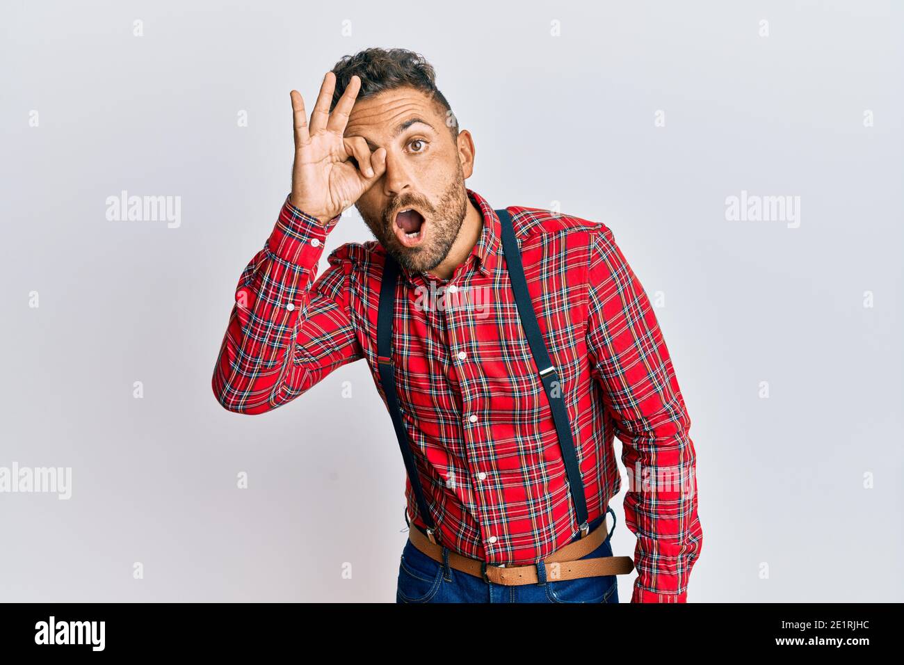 Handsome man with beard wearing hipster elegant look doing ok gesture ...