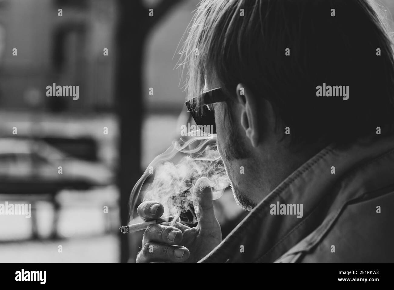 A smoking man from behind, portrait of a smoking man from behind, smoke ...