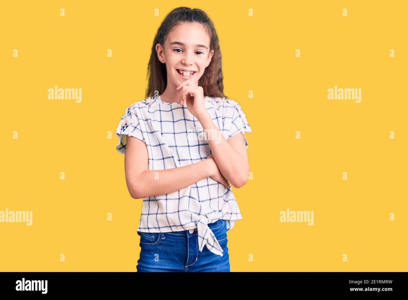 Cute hispanic child girl wearing casual clothes looking confident at ...