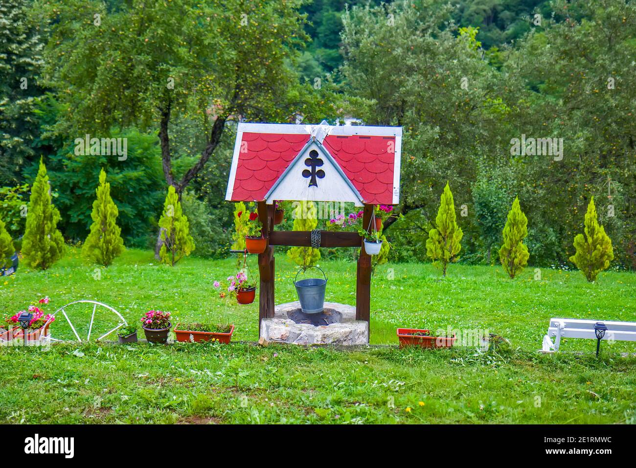 Small water well in the garden Stock Photo - Alamy