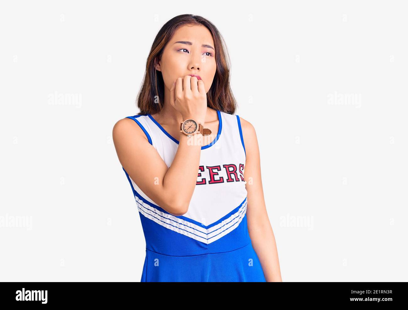 Young Beautiful Chinese Girl Wearing Cheerleader Uniform Looking