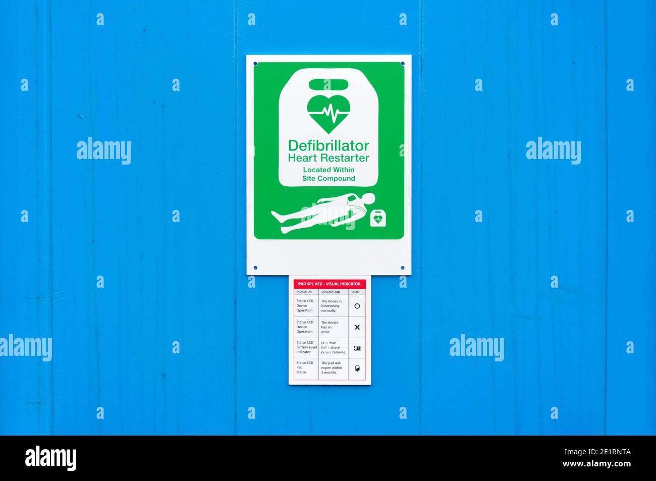 Defibrillator AED sign on wall in public space for emergency heart ...