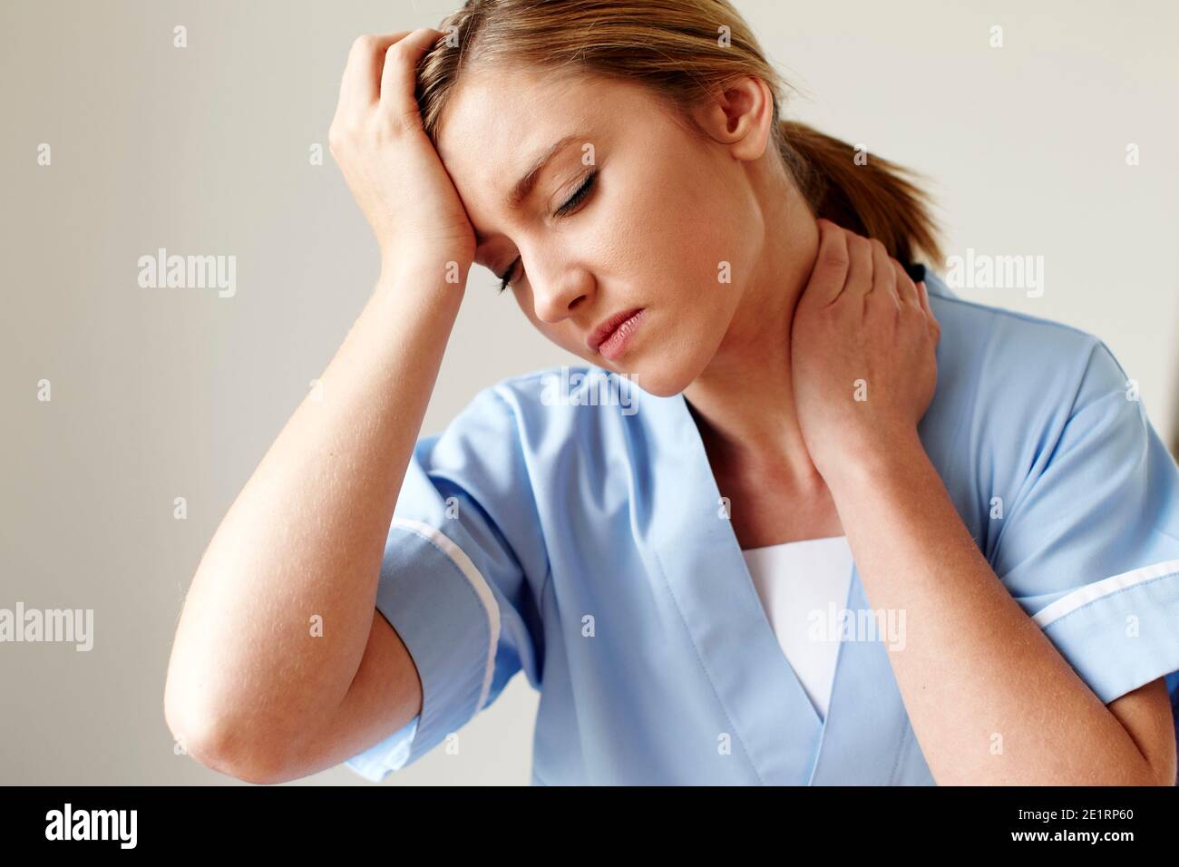 Tired nurse at work Stock Photo - Alamy