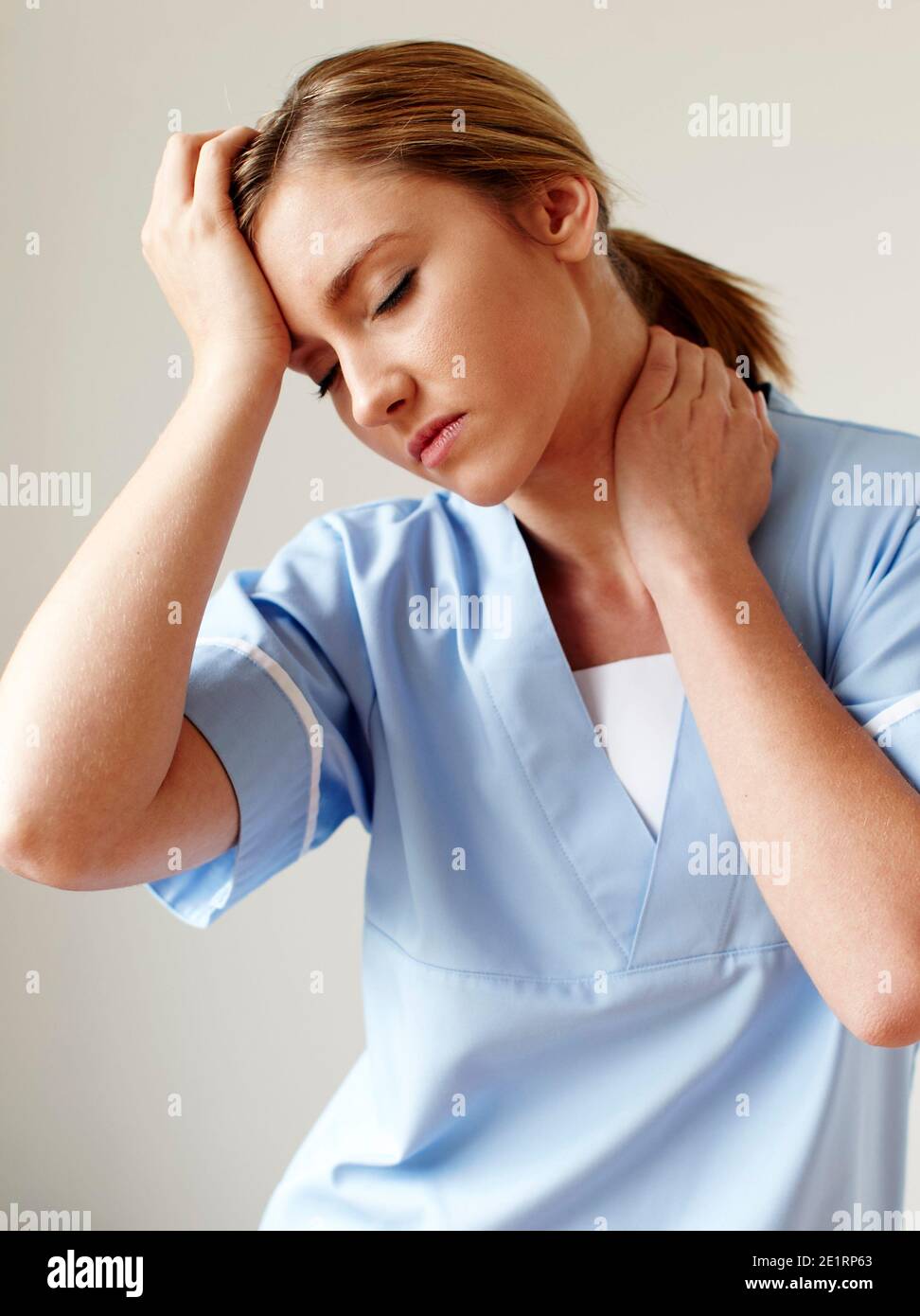 Tired nurse at work Stock Photo - Alamy