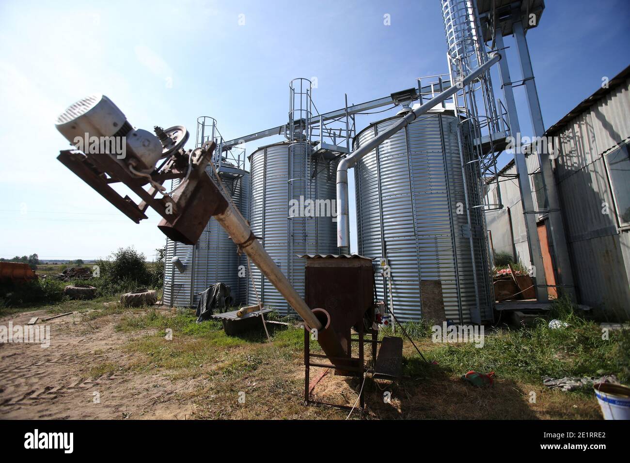 Towers of grain drying enterprise. metal grain facility with silos ...