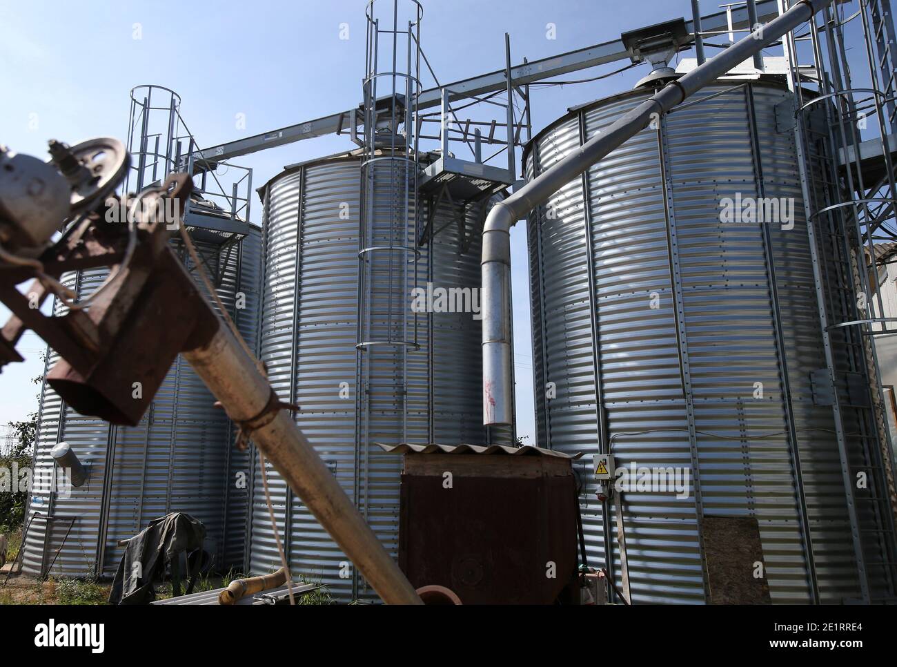 Towers of grain drying enterprise. metal grain facility with silos ...
