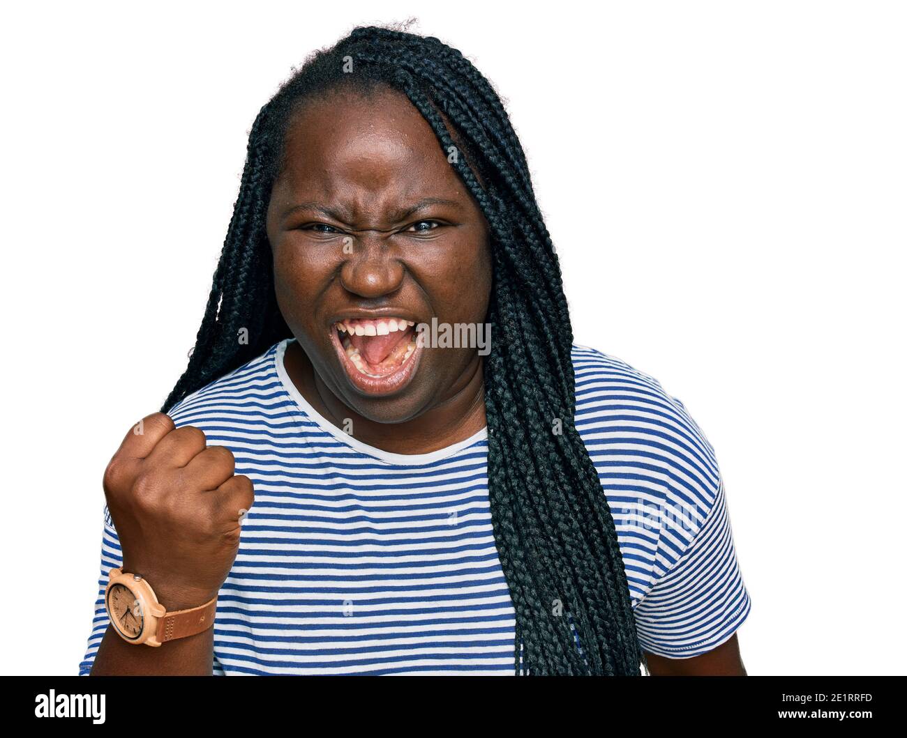 Young black woman with braids wearing casual clothes angry and mad ...