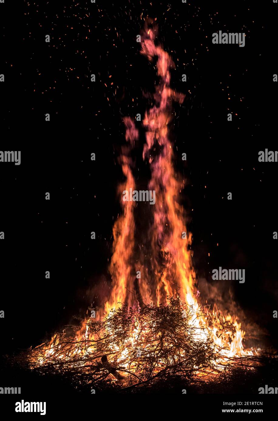 Branches on fire. Flames and sparkles on black background Stock Photo ...