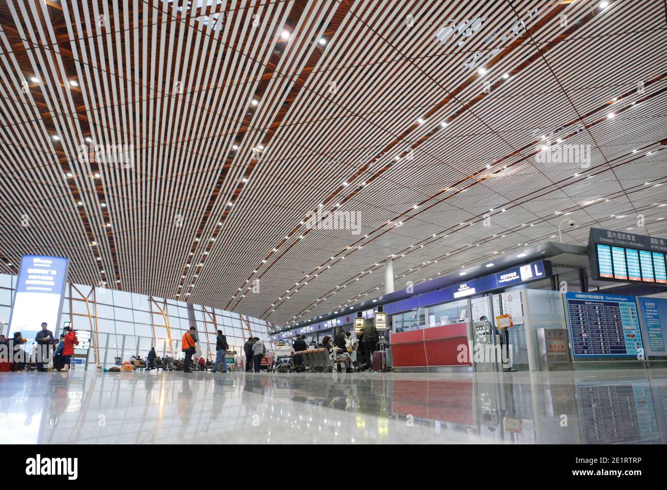 Chinese business womanat the check in counters in the new Terminal 3 ...