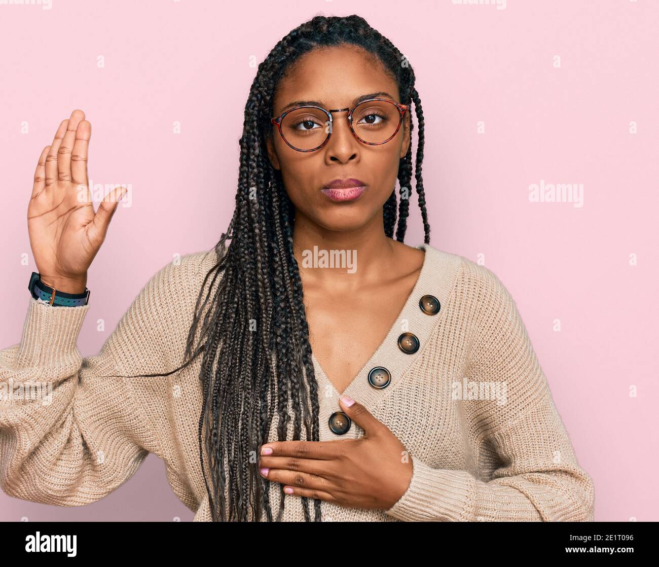 African american woman wearing casual clothes swearing with hand on ...