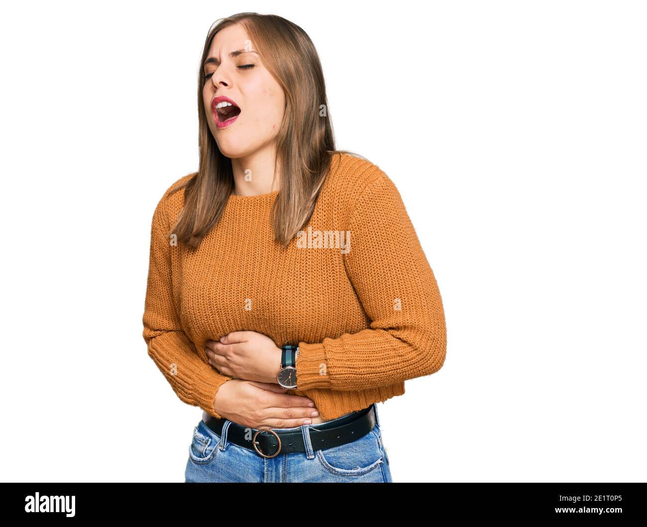 Beautiful caucasian woman wearing casual clothes with hand on stomach ...