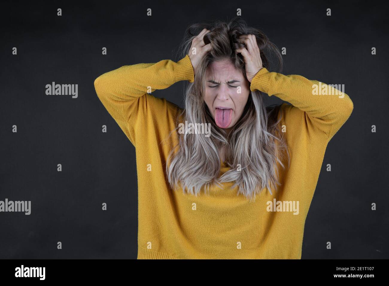 Angry woman tearing her hair because anger, pain or stress Stock Photo ...