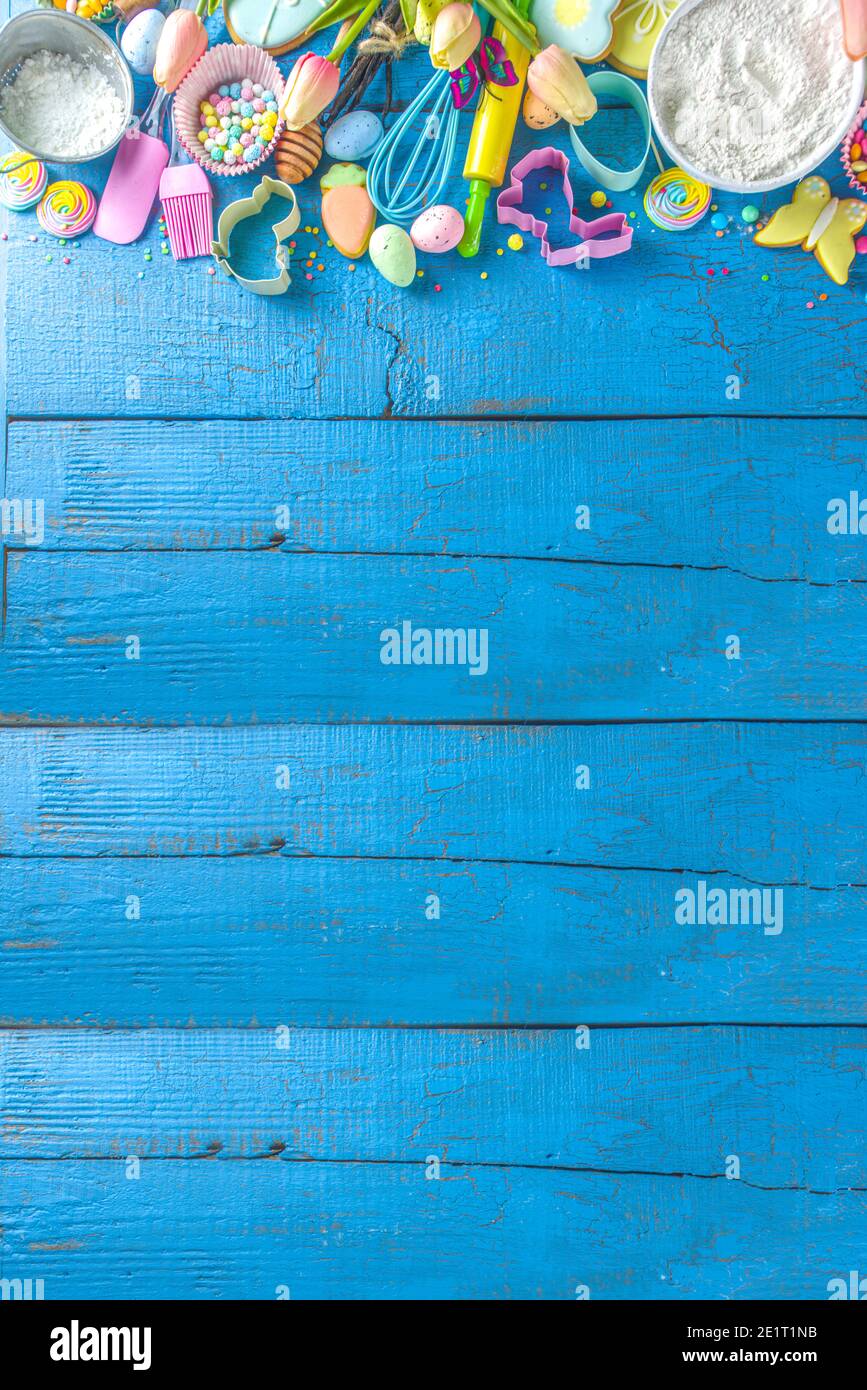 Easter baking background with rolling pin, whisk, eggs, flour and ...