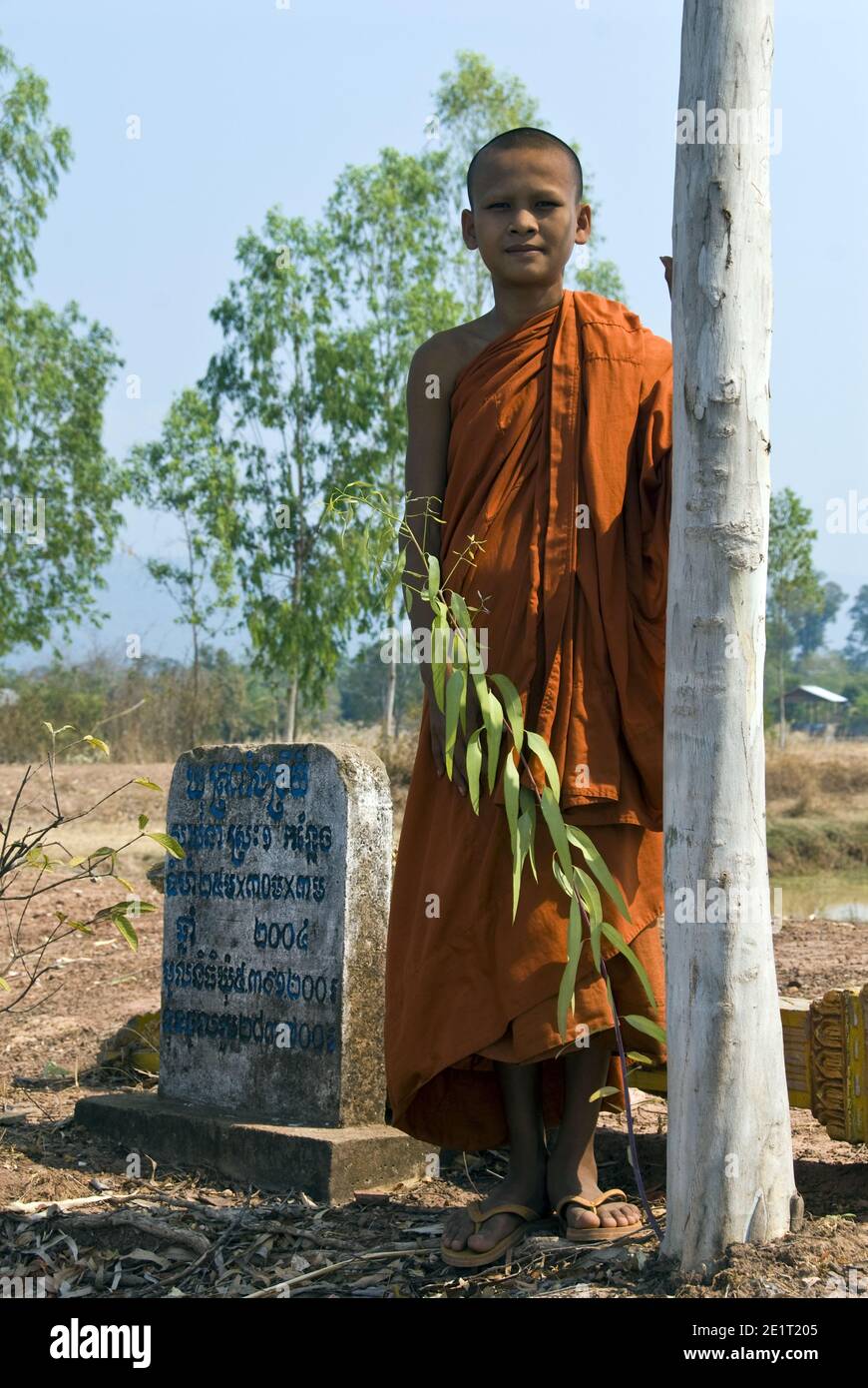 A young monk near the spot where dictator Pol Pot was cremated and ...
