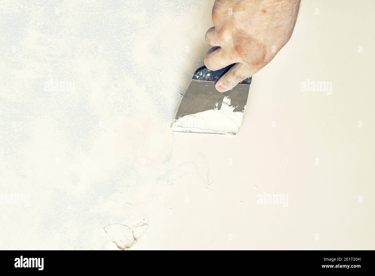 the process of leveling the wall before painting. repairs. copy space ...